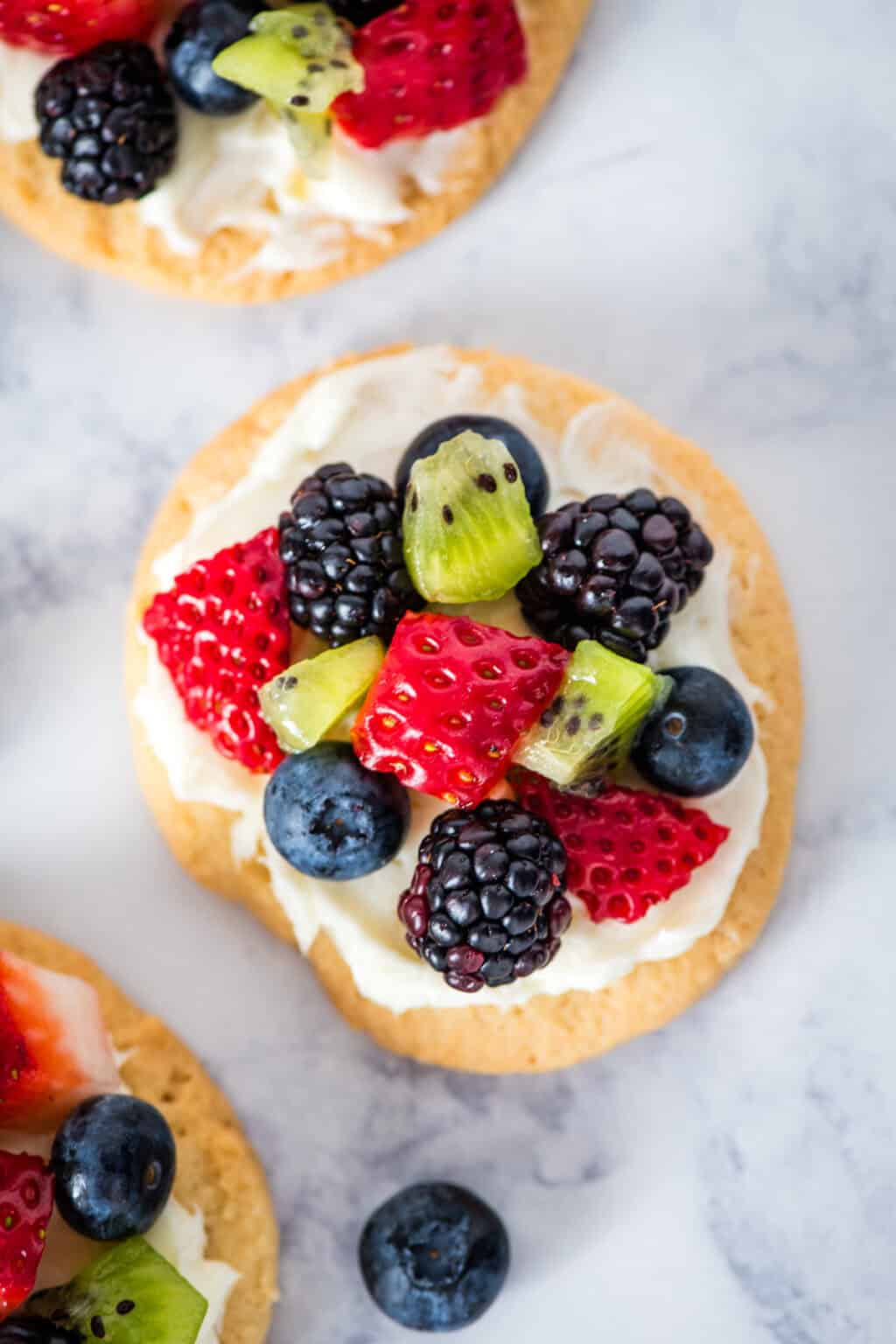 Easy Mini Fruit Pizza Cookies With Sugar Cookie Crust - Adventures of Mel